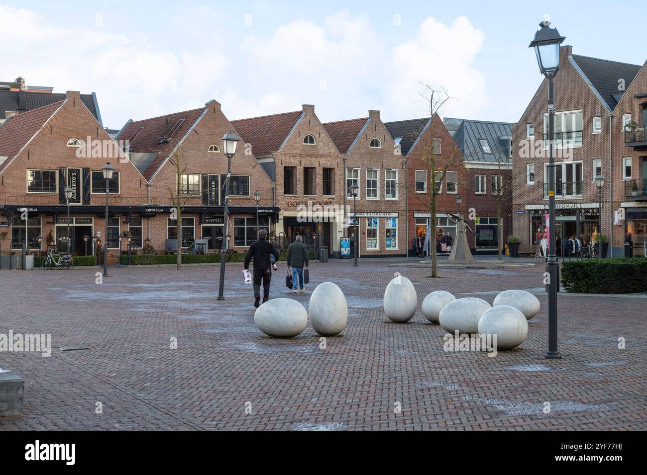 Square with shops in the center of the rural village of Nijkerk in ...