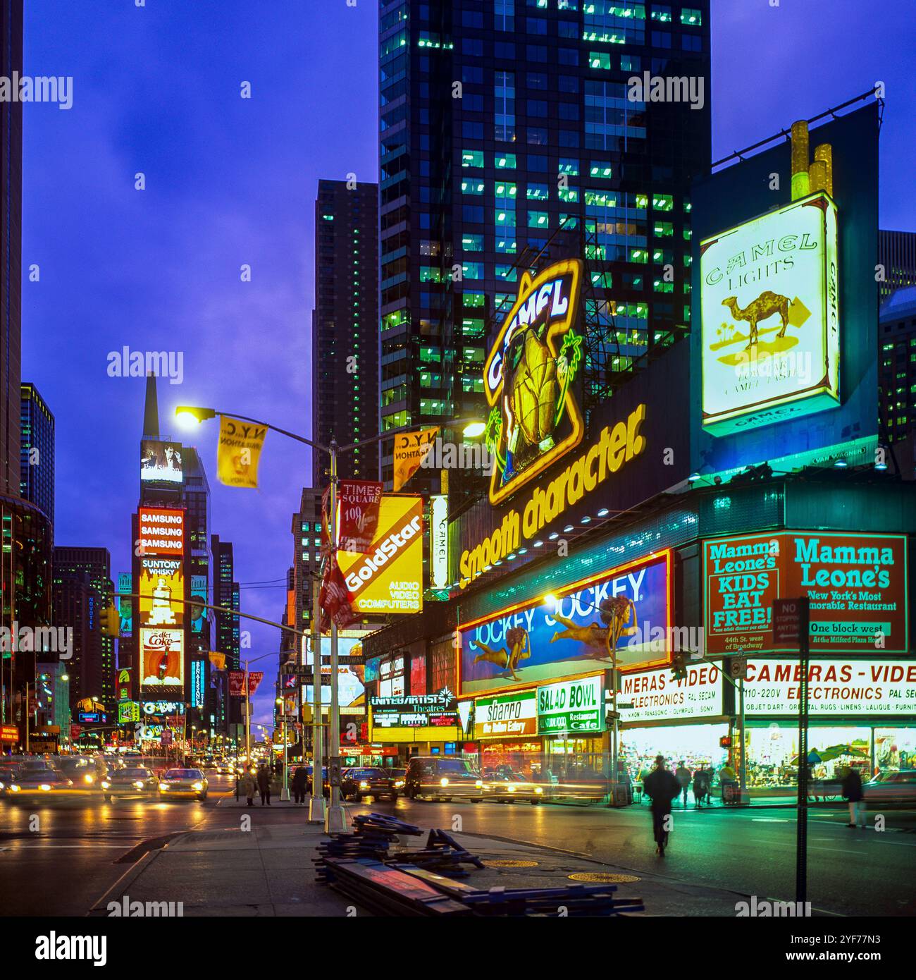 New York 1990s, Times square at dusk, illuminated advertising signs ...