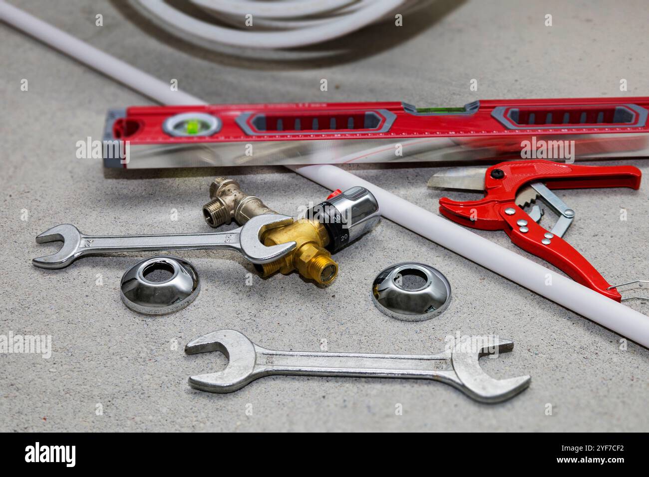 A complete set of essential tools that features a wrench, a pipe cutter ...