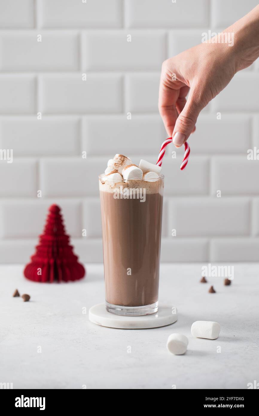 Woman puts candy cane hi-res stock photography and images - Alamy