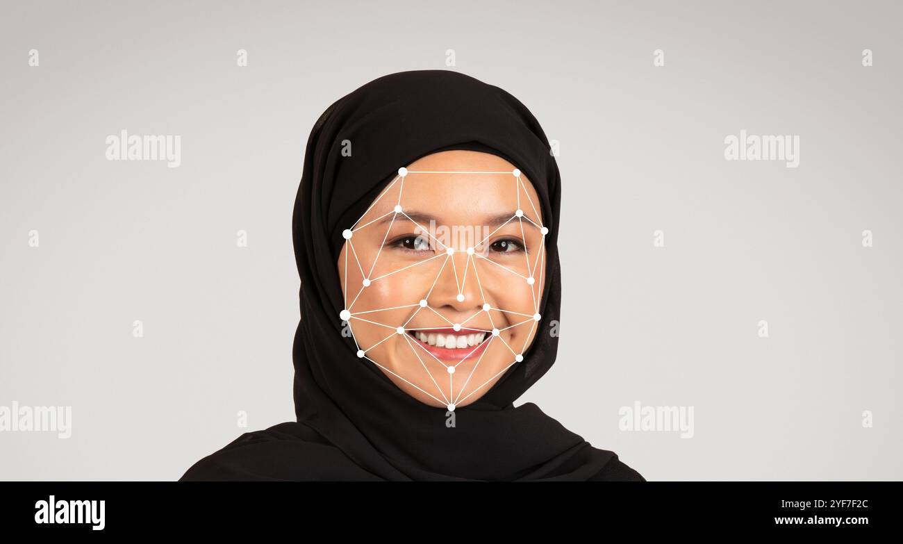 Smiling woman in hijab with facial recognition technology overlay at ...