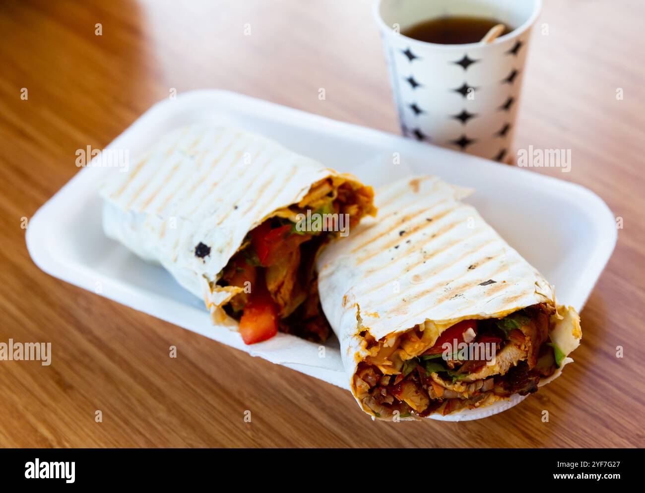Turkish fast food, wrapped dish durum kebab Stock Photo - Alamy