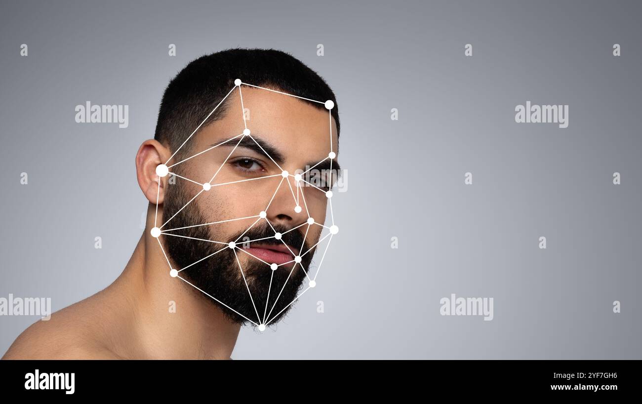 A young man with a beard showcasing facial recognition technology Stock Photo - Alamy