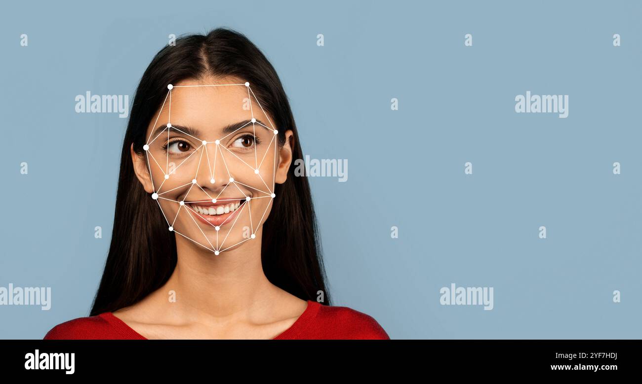 Woman smiling with facial recognition technology overlay in a studio ...