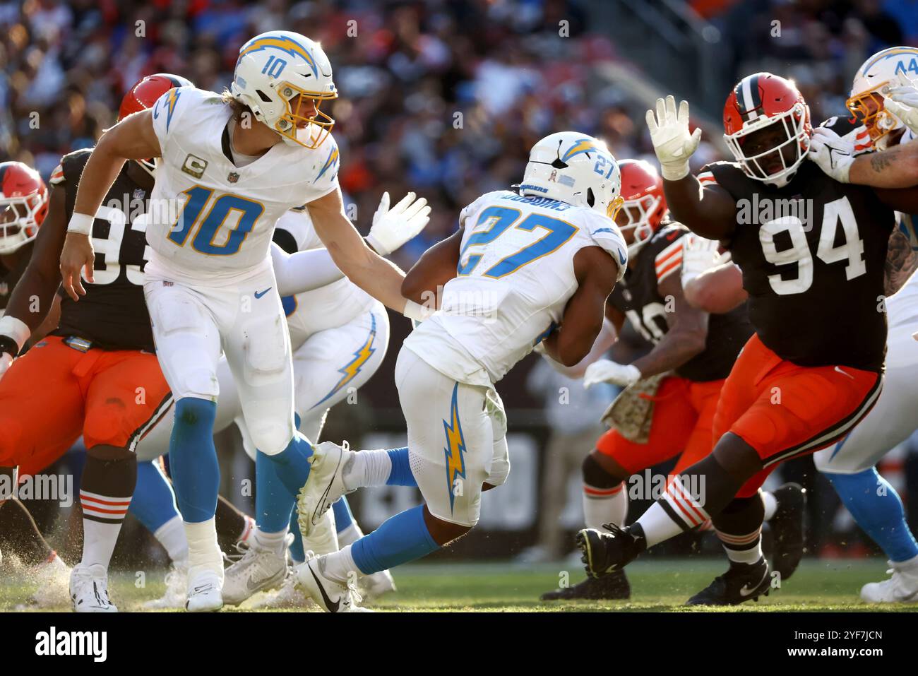Los Angeles Chargers quarterback Justin Herbert (10) hands the ball off ...