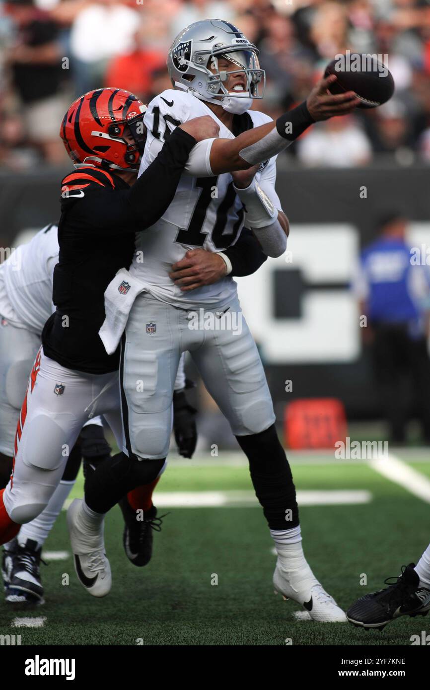 Cincinnati, Ohio, USA. 3rd Nov, 2024. Las Vegas Raiders QB Desmond Ridder gets hit as he throws ...