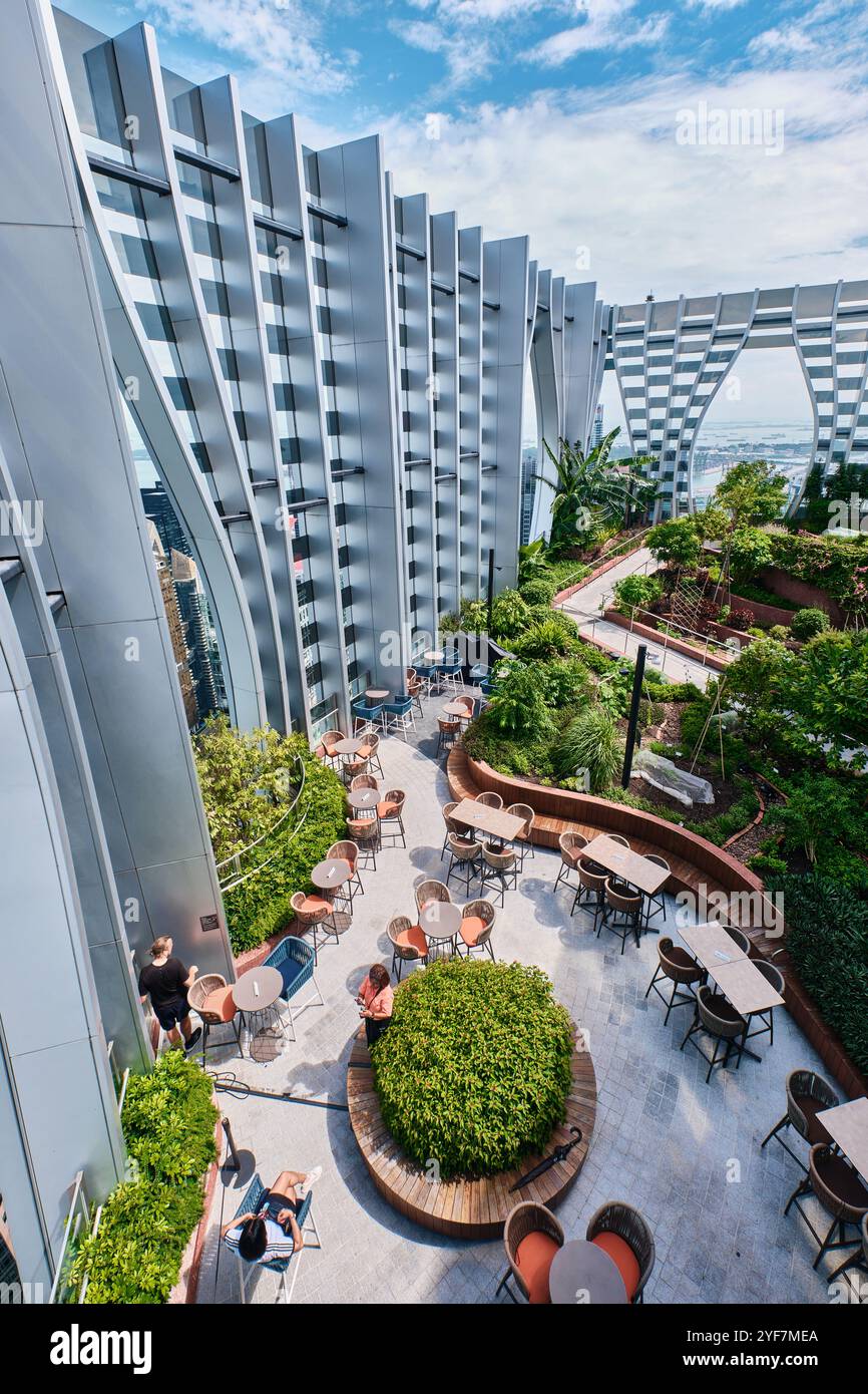 Singapore - August 16, 2024: CapitaSpring skyscraper with walkways and ...