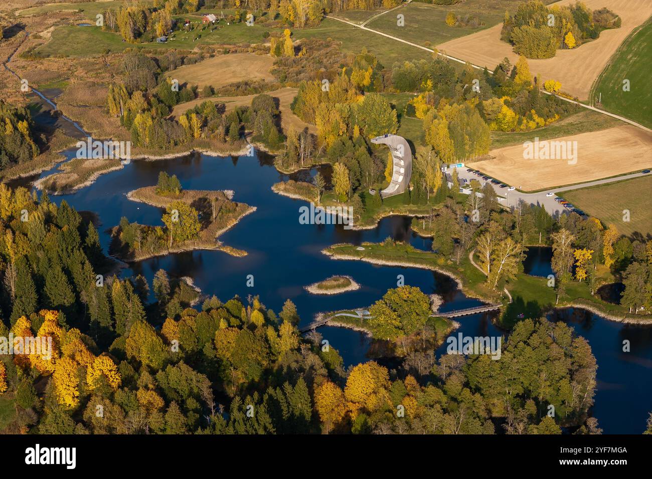 Aerial view captures vibrant autumn foliage, an observation tower, and ...