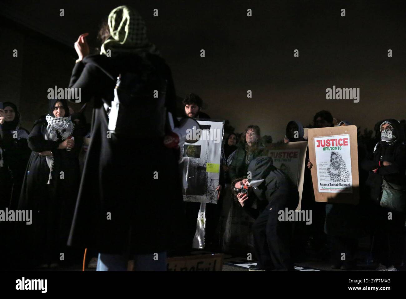 Reigate, England, UK. 2nd Nov, 2024. Protesters stand outside the ...