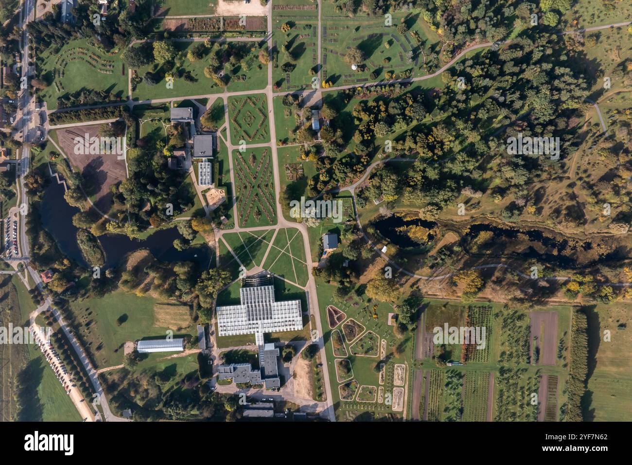 Aerial perspective of a botanical garden featuring a central greenhouse ...