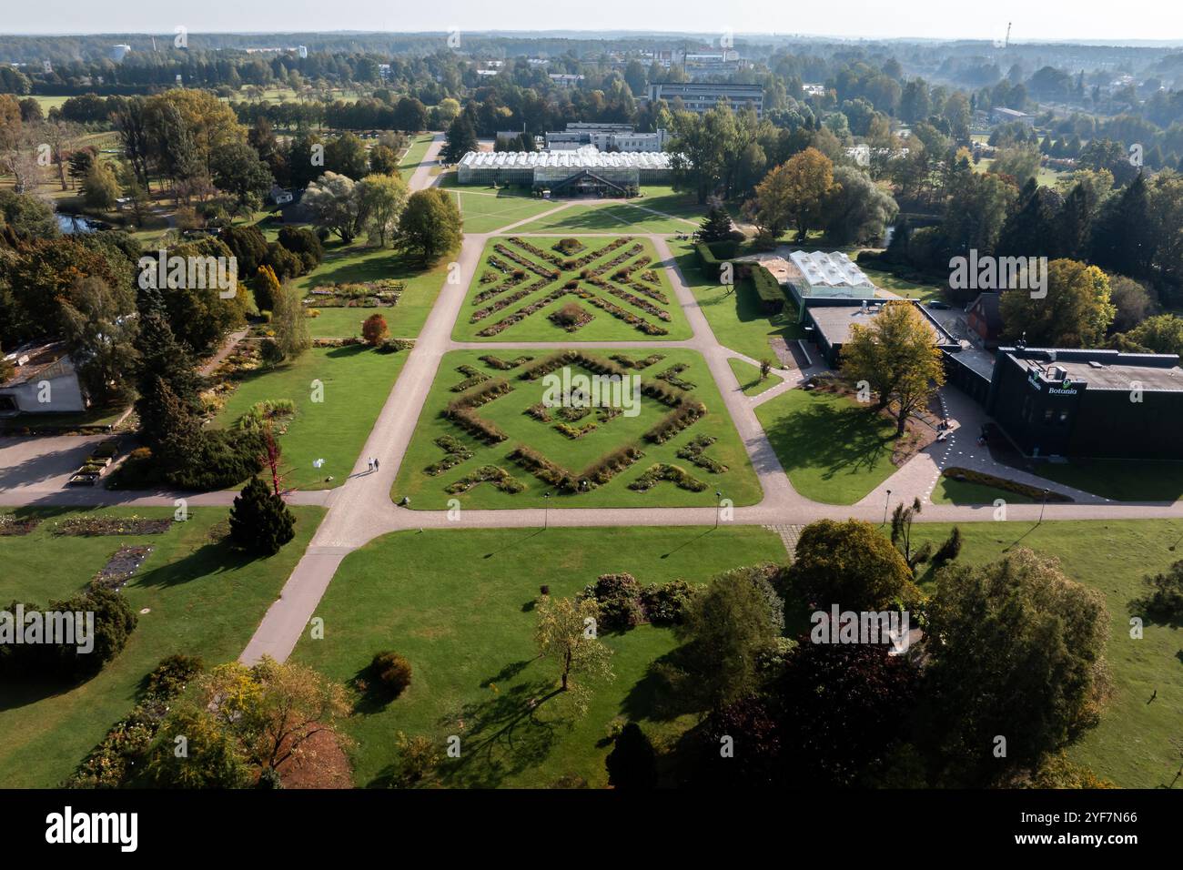 An aerial view of a botanical garden features geometric flower beds ...