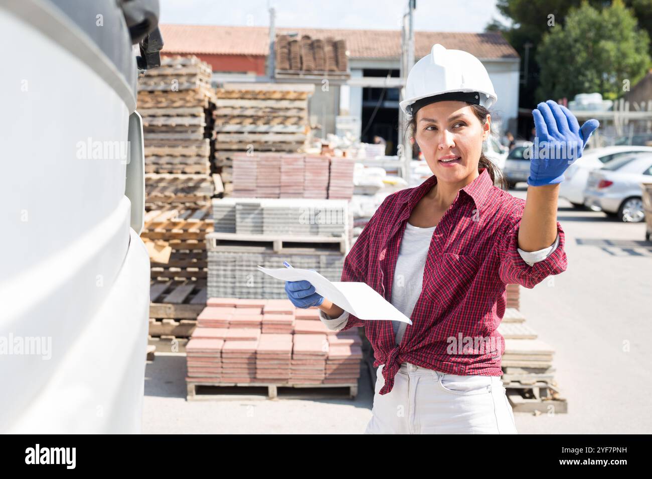 Asian woman manager keeps records of construction materials Stock Photo ...