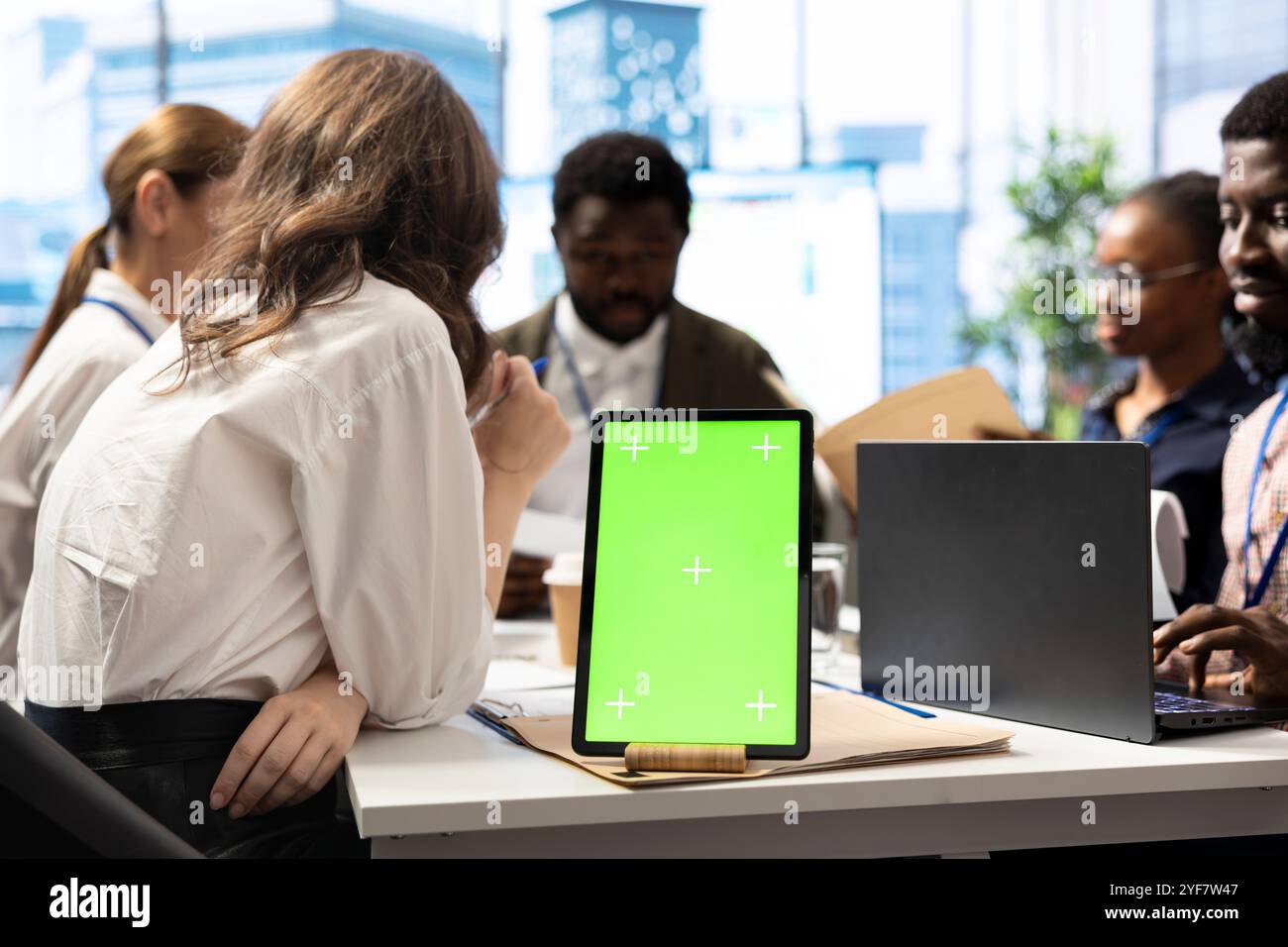 Employees using green screen laptop hi-res stock photography and images ...