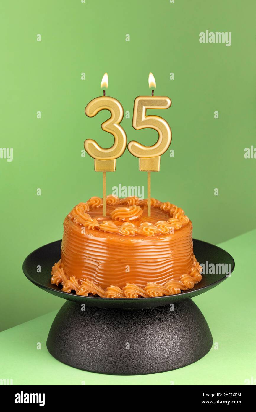 Number 35 birthday candle on a green background - Delicious cake with ...