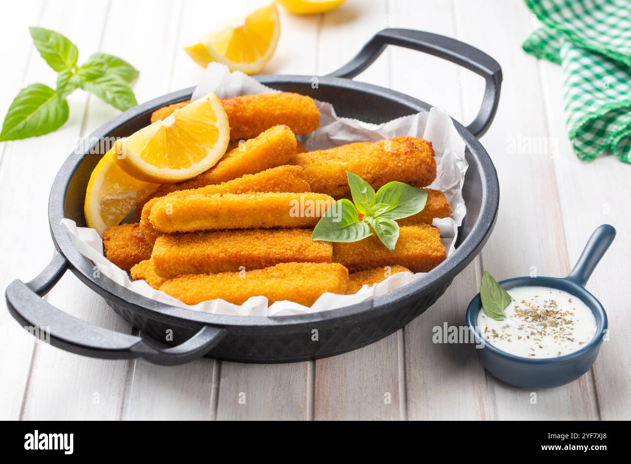 Golden roast Fish Sticks Fingers with sauce. Delicious fish finger ...