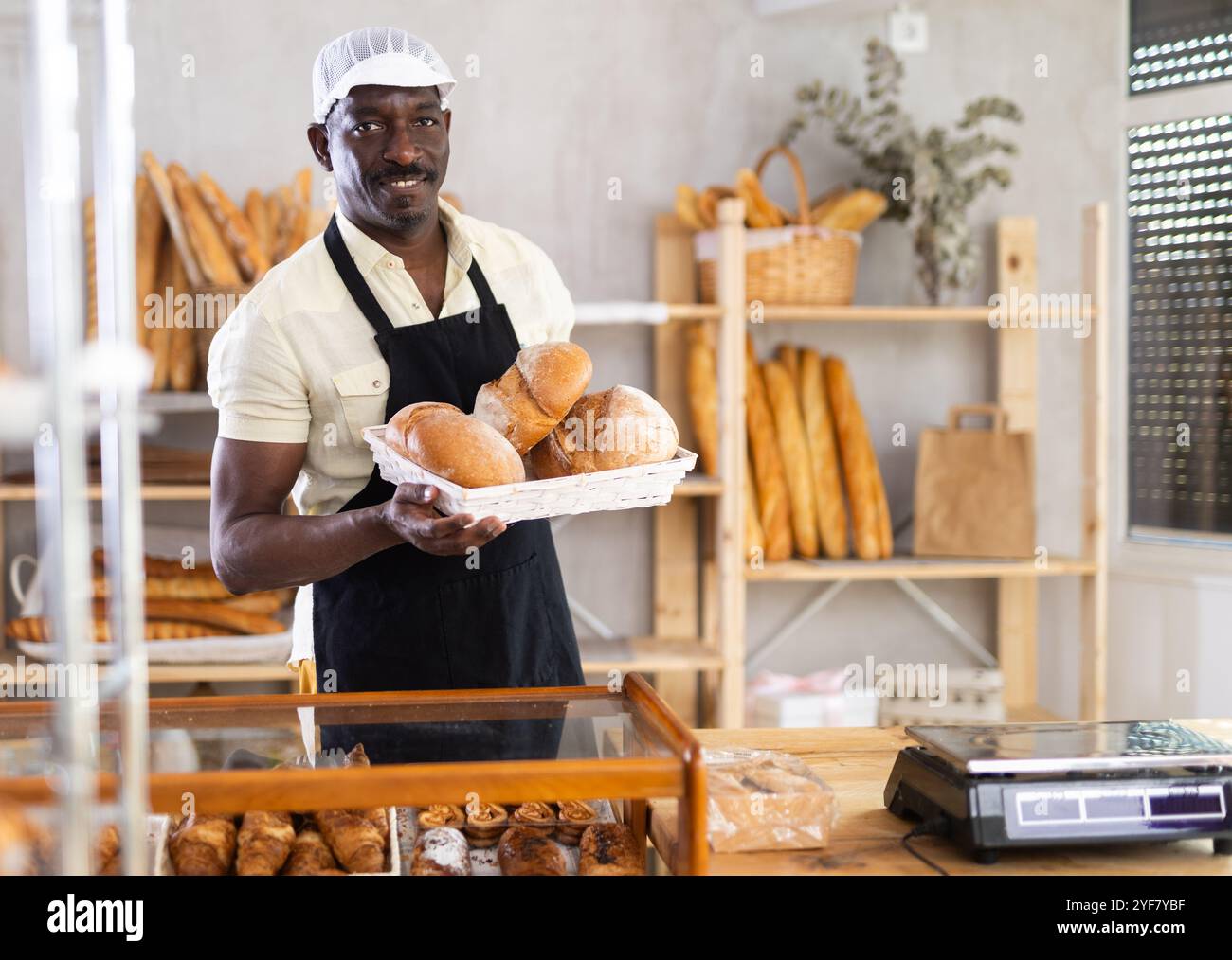 Baker sells bread in hi-res stock photography and images - Alamy