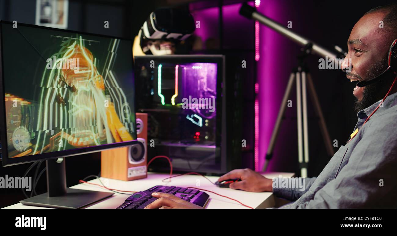 Player using keyboard, mouse and headset to play first person shooter ...