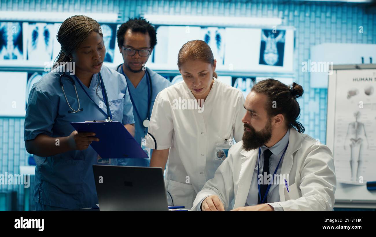 Irritated doctor working with his colleague to find treatment plan ...