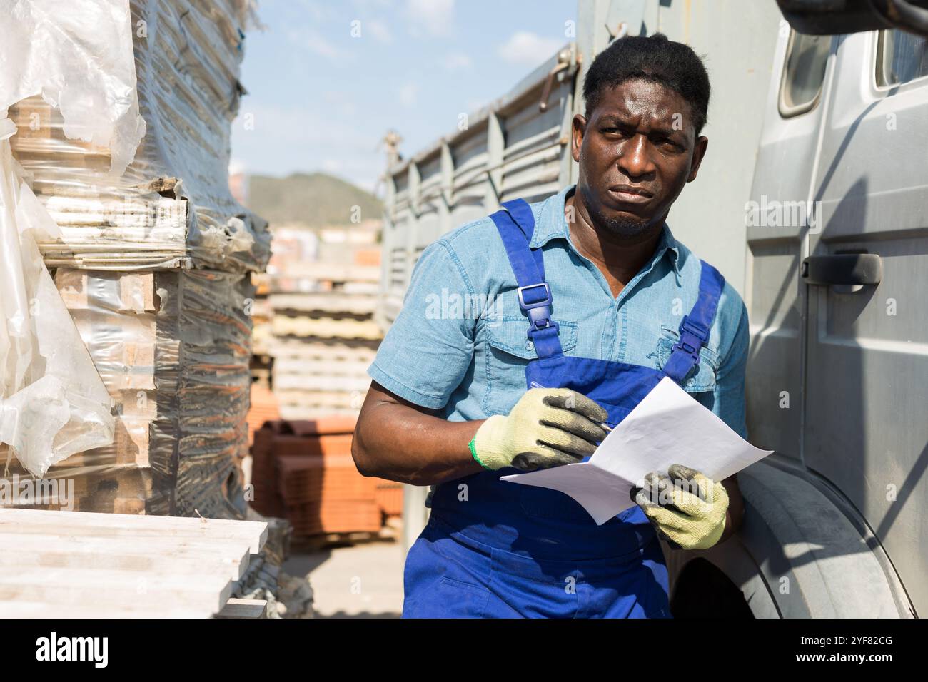 Driver keeps records of materials when loading into back of truck at ...