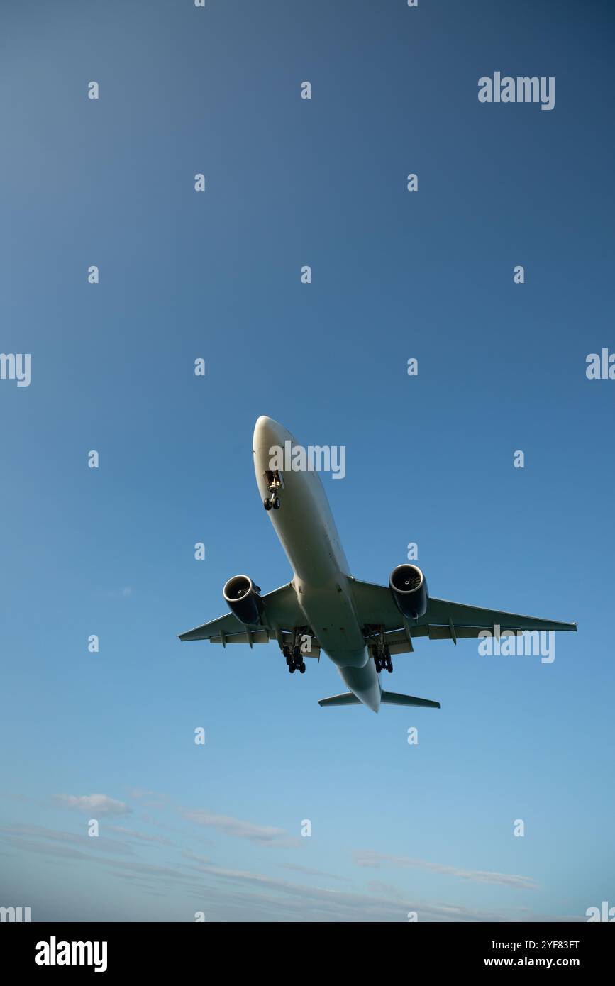 Landing passenger jet airplane at daytime Stock Photo - Alamy