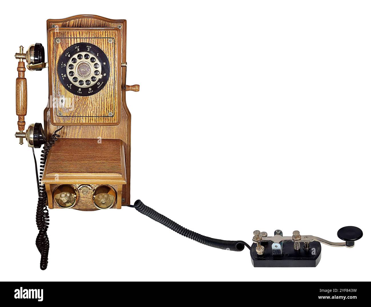Vintage rotary dial wall telephone for making phone calls attached to a ...