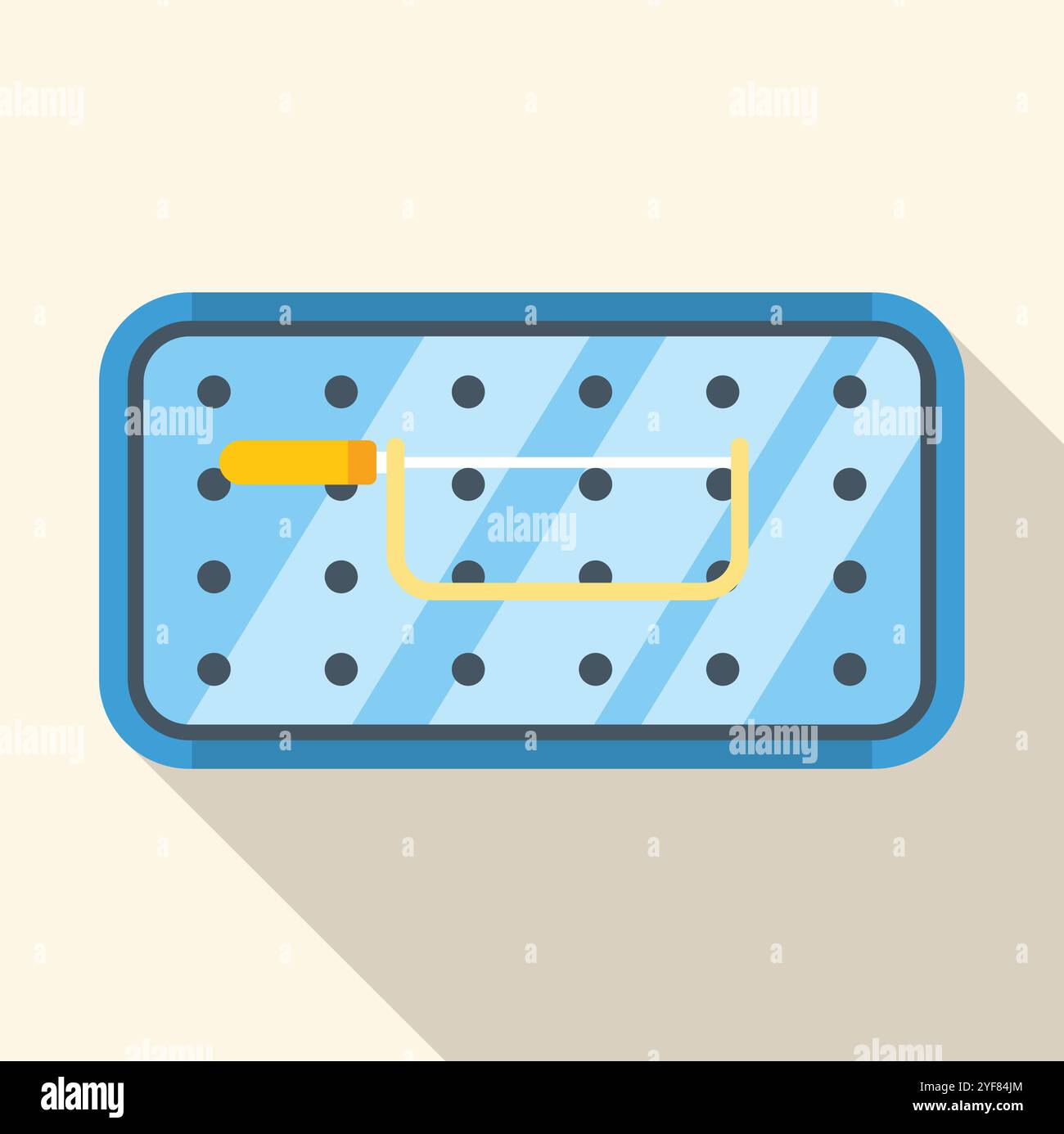 Jeweler's saw frame with a blade placed on a perforated board ...