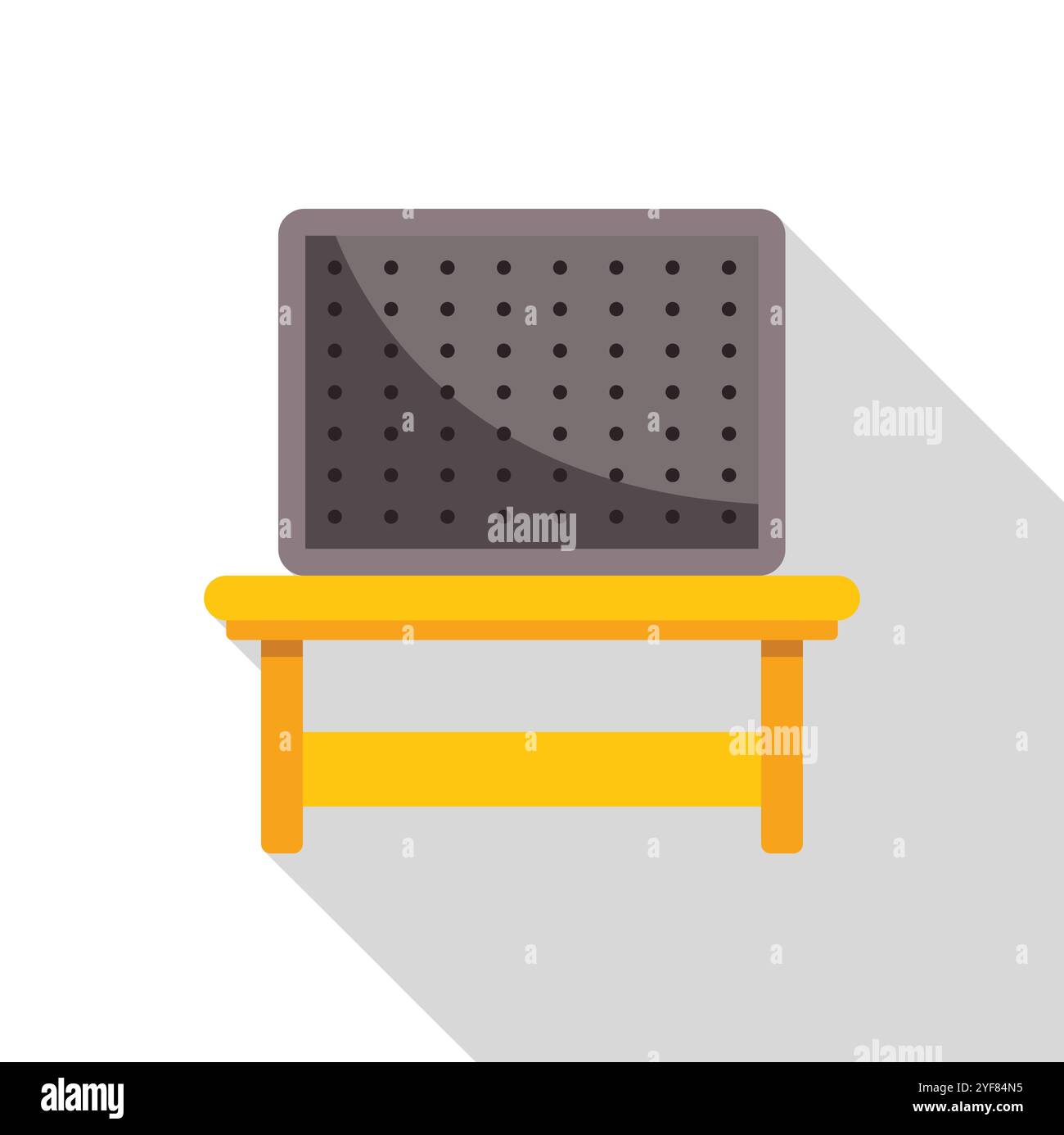 Electronic notice board standing on yellow table, with long shadow ...