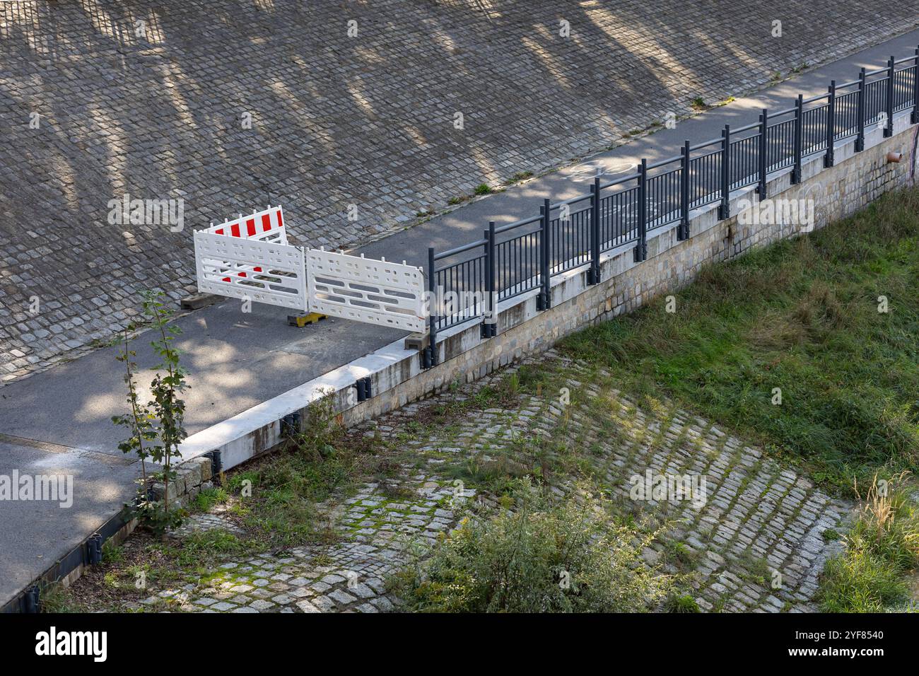 Closed bike path next to river blocked due to flooding after heavy ...