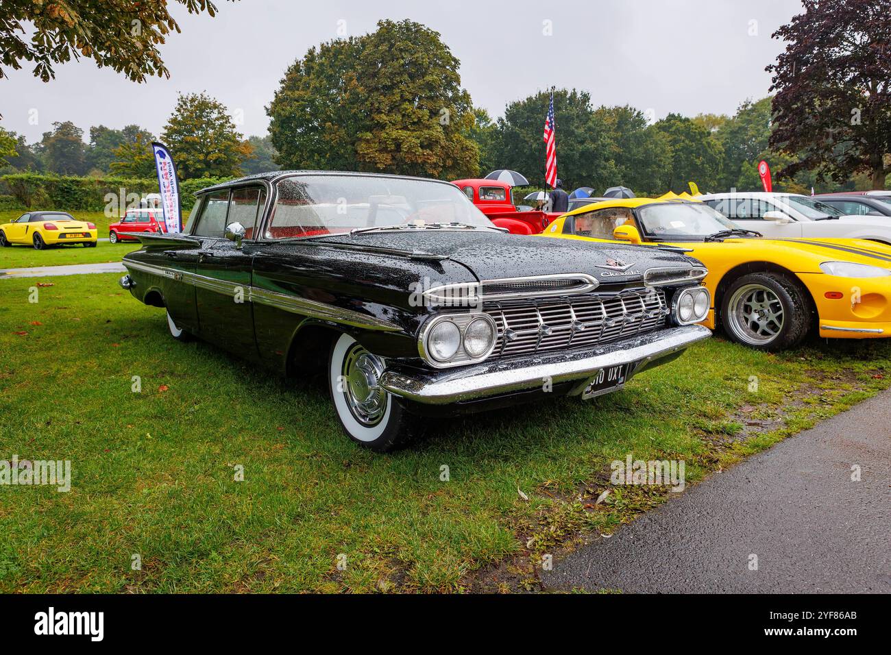 Black Chevrolet Impala car on display at a classic car show in ...