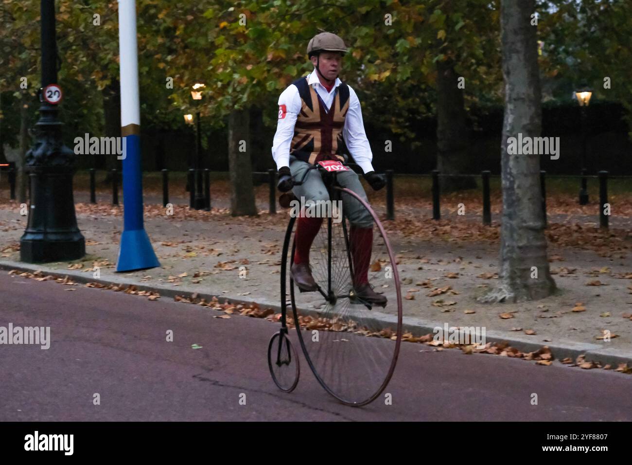 London, UK. 3rd November, 2024. A Penny Farthing rider participates in ...