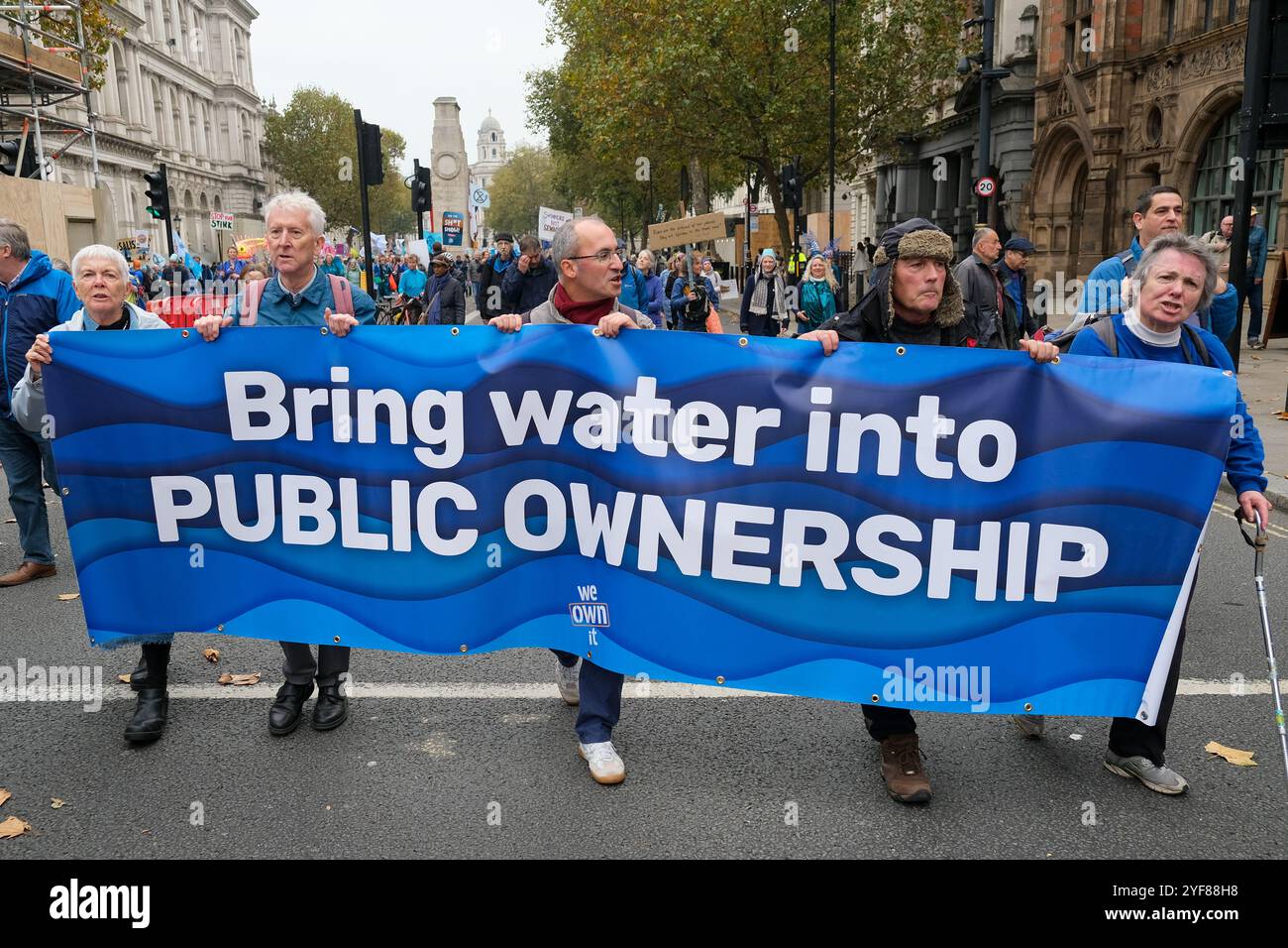 March for Water protetesters hold a banner calling for water companies ...