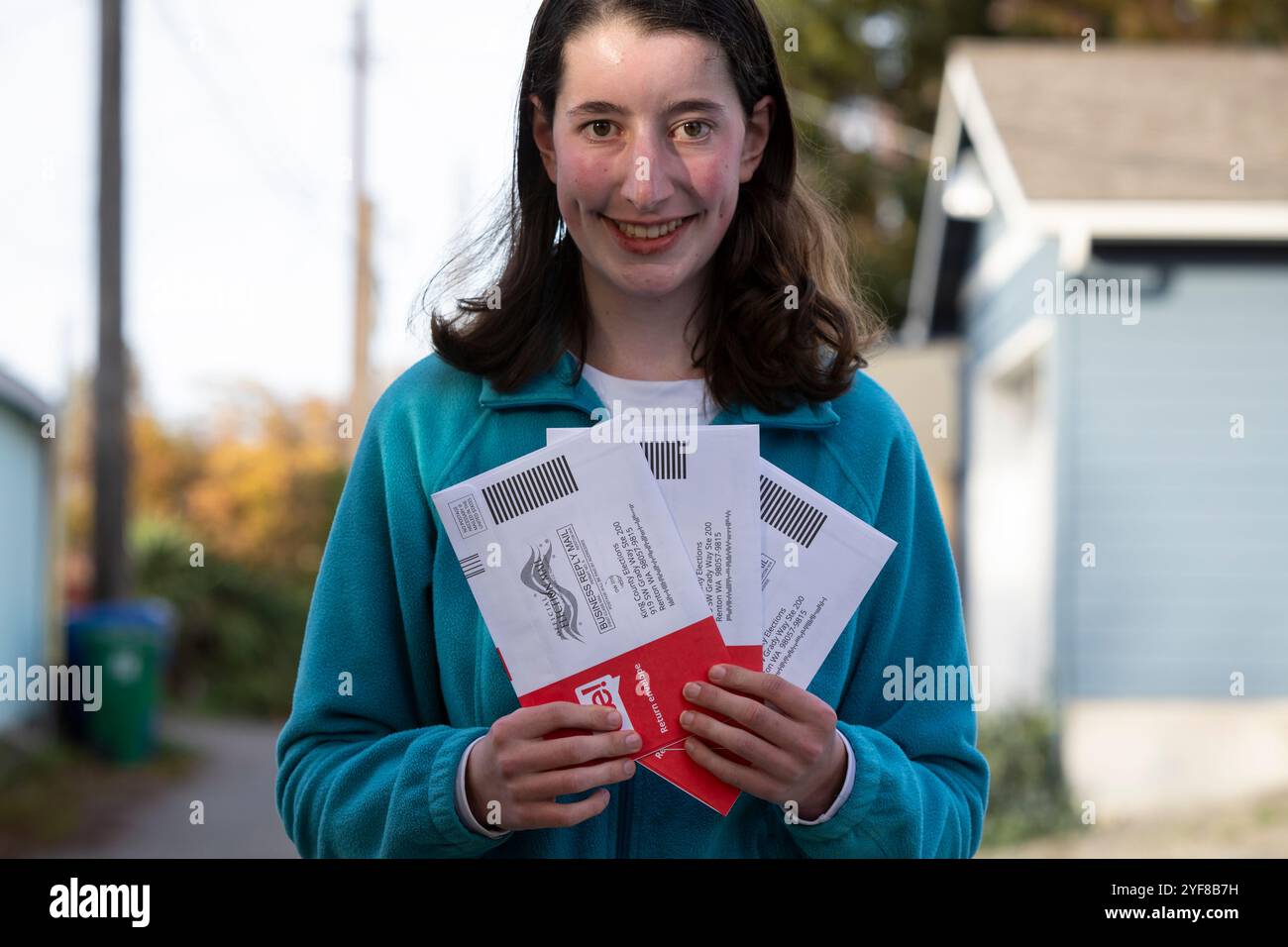 Seattle, Washington, USA. 3rd November, 2024. Ella Wright poses with her family's ballots at a ...