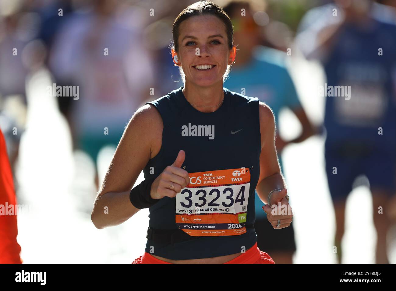 Runner Kallie Donley of the United States gives a thumbs up as she ...