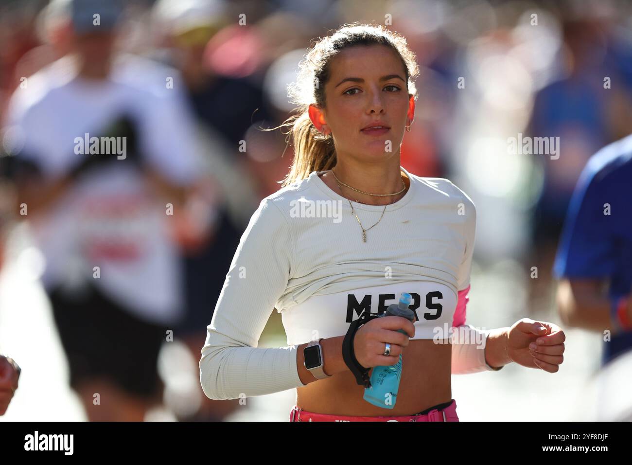 Runner Meredith Shank of the United States heads up First Avenue during ...