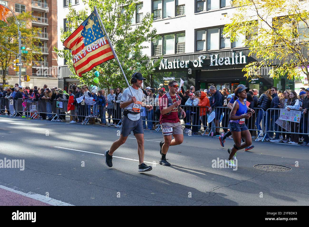 Runners trudge up First Avenue at Mile 16 of the 2024 New York City ...