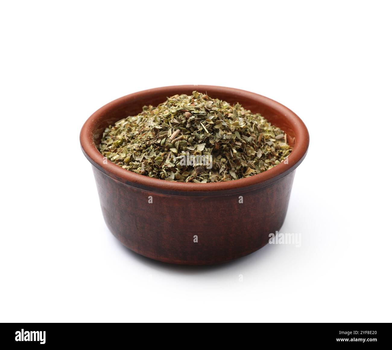 Dried oregano in bowl isolated on white Stock Photo - Alamy