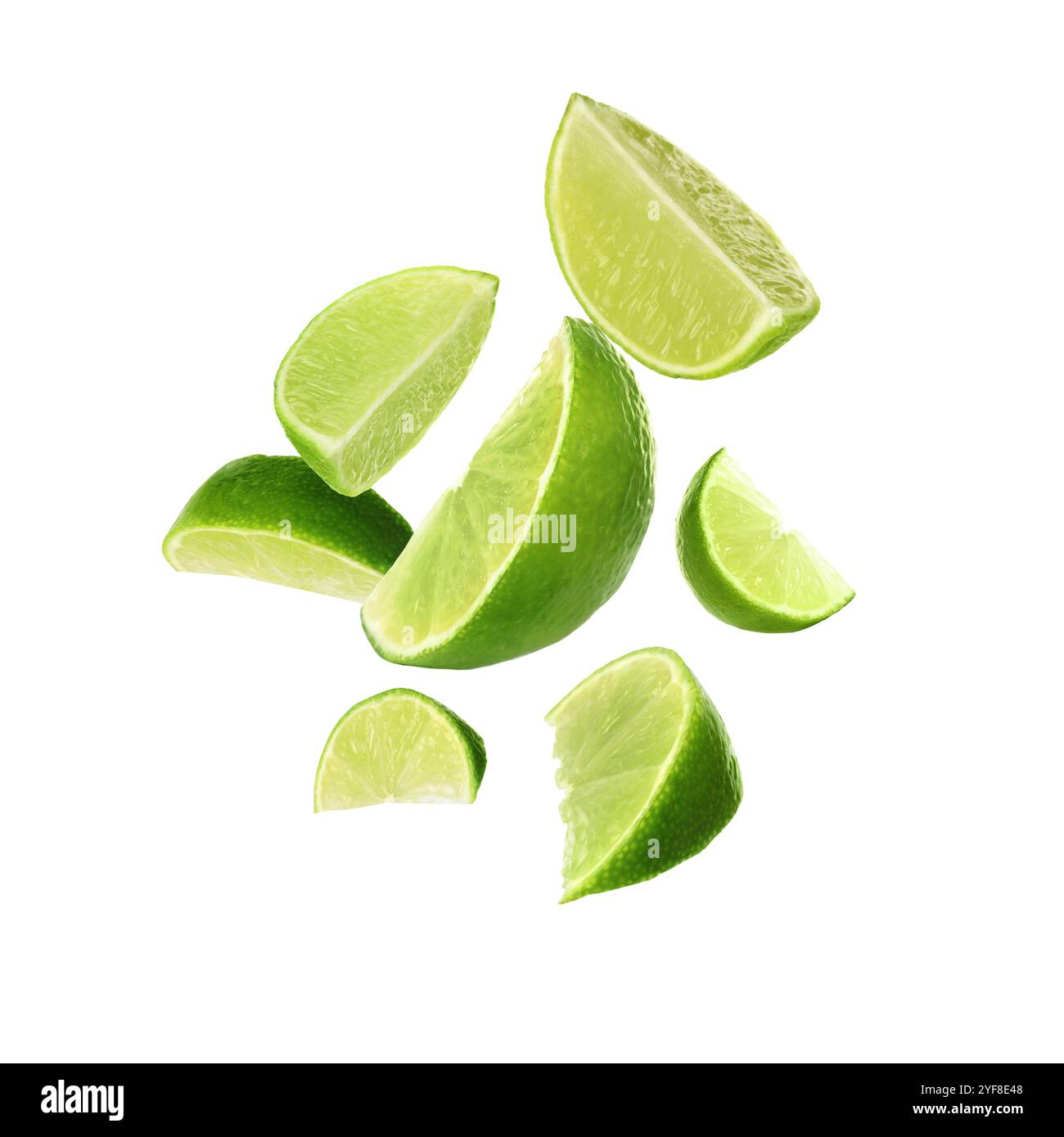 Lime pieces in air on white background. Citrus fruit Stock Photo - Alamy