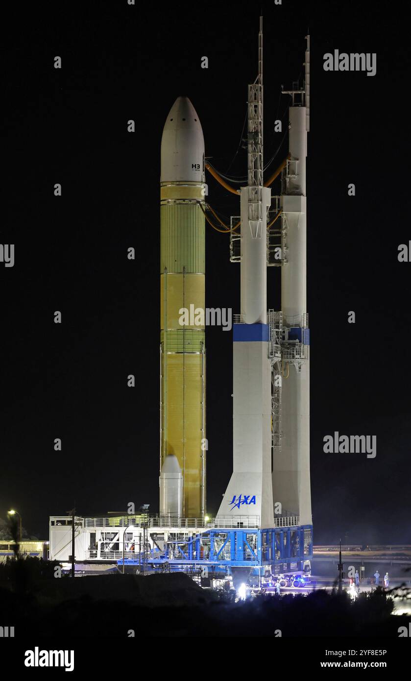Japan's large-scale main rocket, "H3," moves to a launch pad by a ...