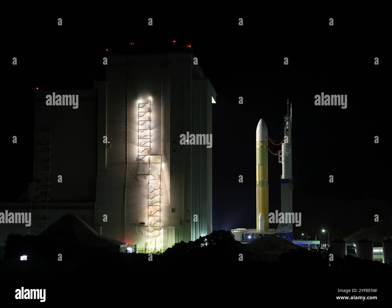 Japan's large-scale main rocket, "H3," moves to a launch pad by a ...