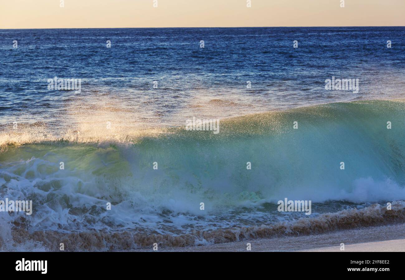Blue wave on the beach. Dramatic natural background Stock Photo - Alamy