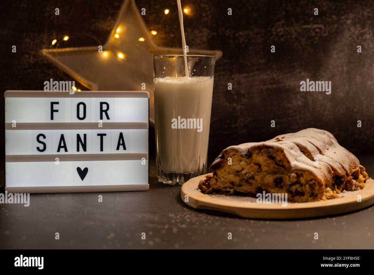 Lightbox with text FOR SANTA Christmas Stollen with glass of pouring ...