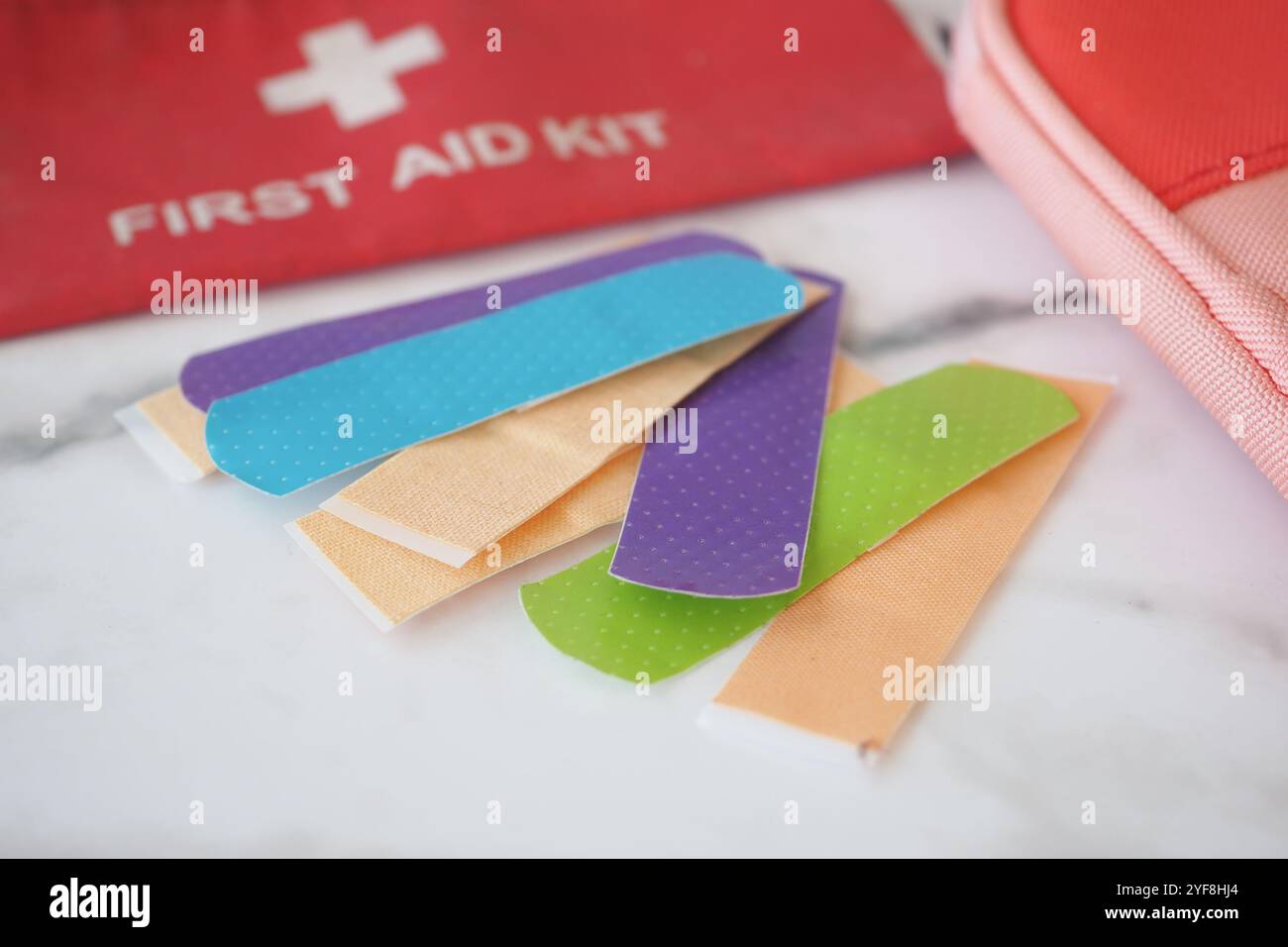 Colorful Bandaids and a wellorganized First Aid Kit on a stunning ...