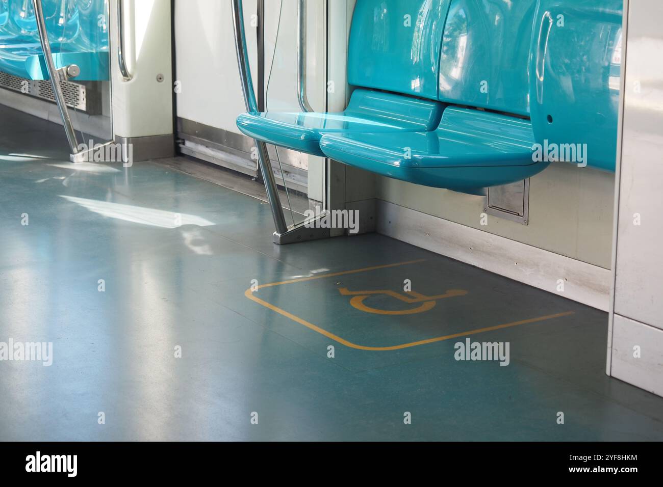 Empty Train Seat with Accessibility Symbol on Floor Stock Photo - Alamy
