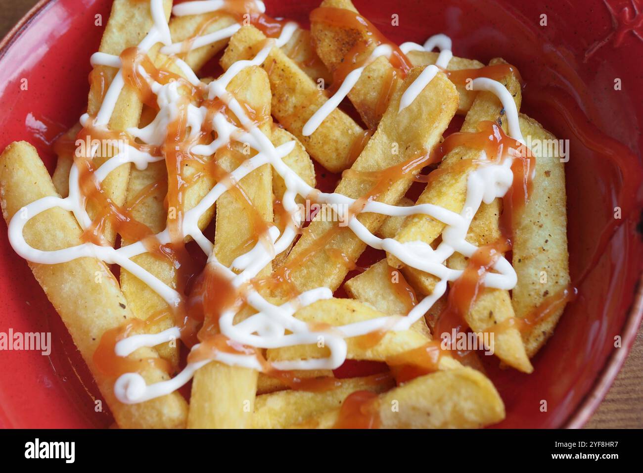 Scrumptious Golden Fries Drizzled with Rich Ketchup and Creamy ...