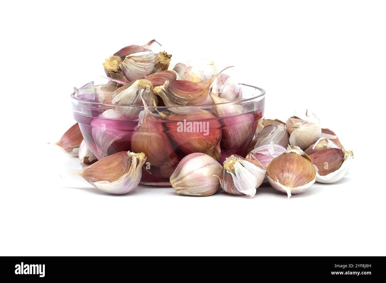 Garlic cloves soak in a potassium permanganate solution, perfect for ...