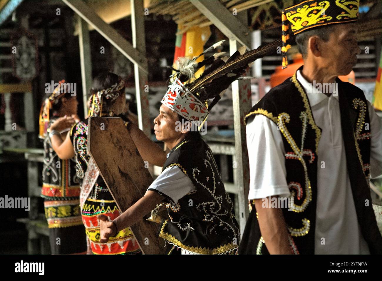 Men and women dance, as they are welcoming guests during an ecotourism ...