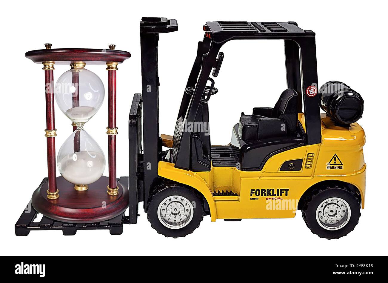 A yellow forklift for moving large objects like an hourglass to show ...