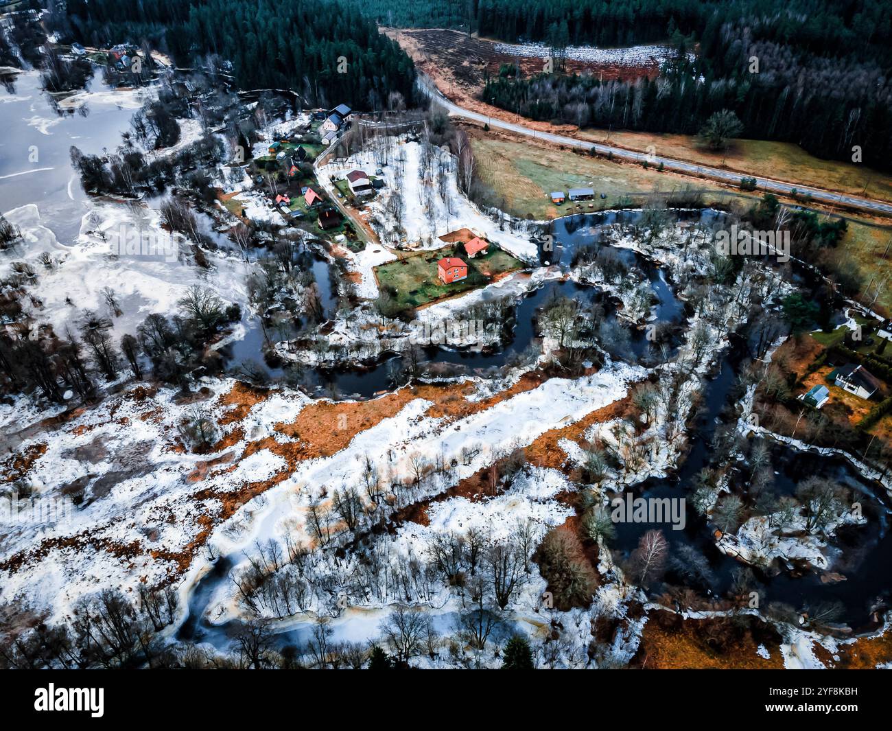 aero drone view of a flooded river during winter, showcasing the ...