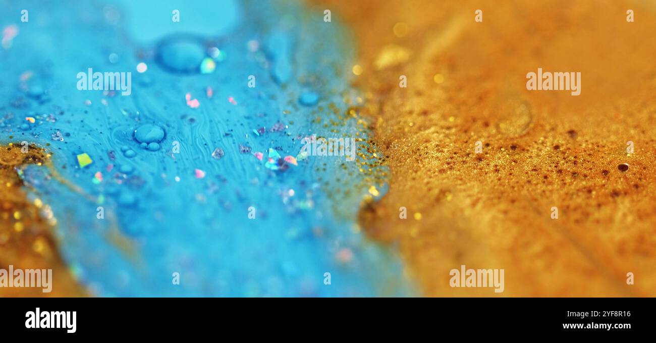 Ink drip. Glitter fluid texture. Defocused blue golden color shiny ...