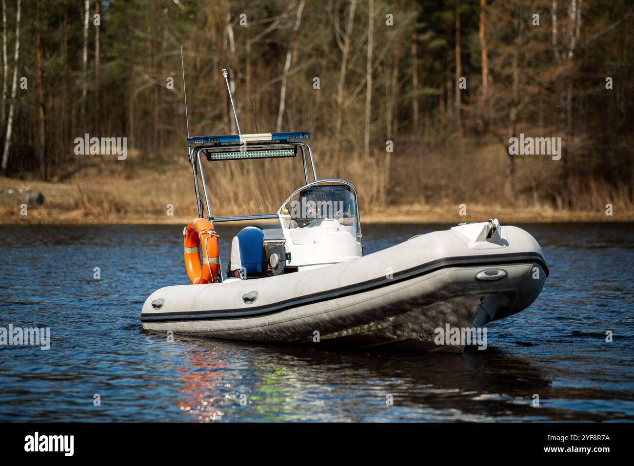 PVC inflatable police boat floats in water Stock Photo - Alamy